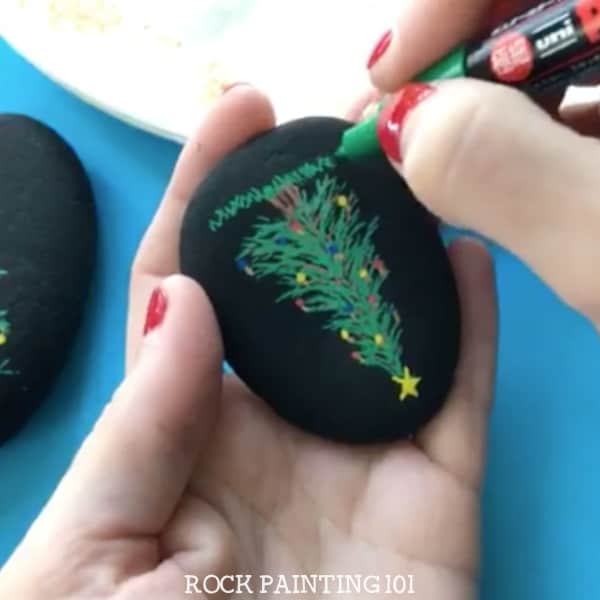 How to paint a Christmas tree to make fun holiday rocks | Rock Painting 101